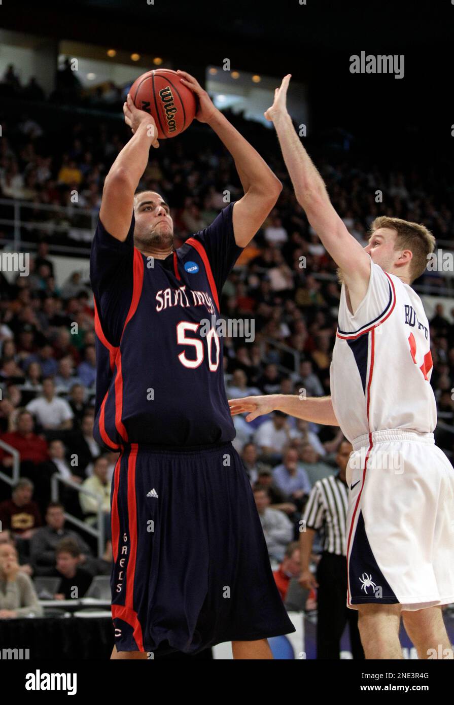 Saint Mary's Omar Samhan (50) shoots against Richmond's Ryan Butler ...