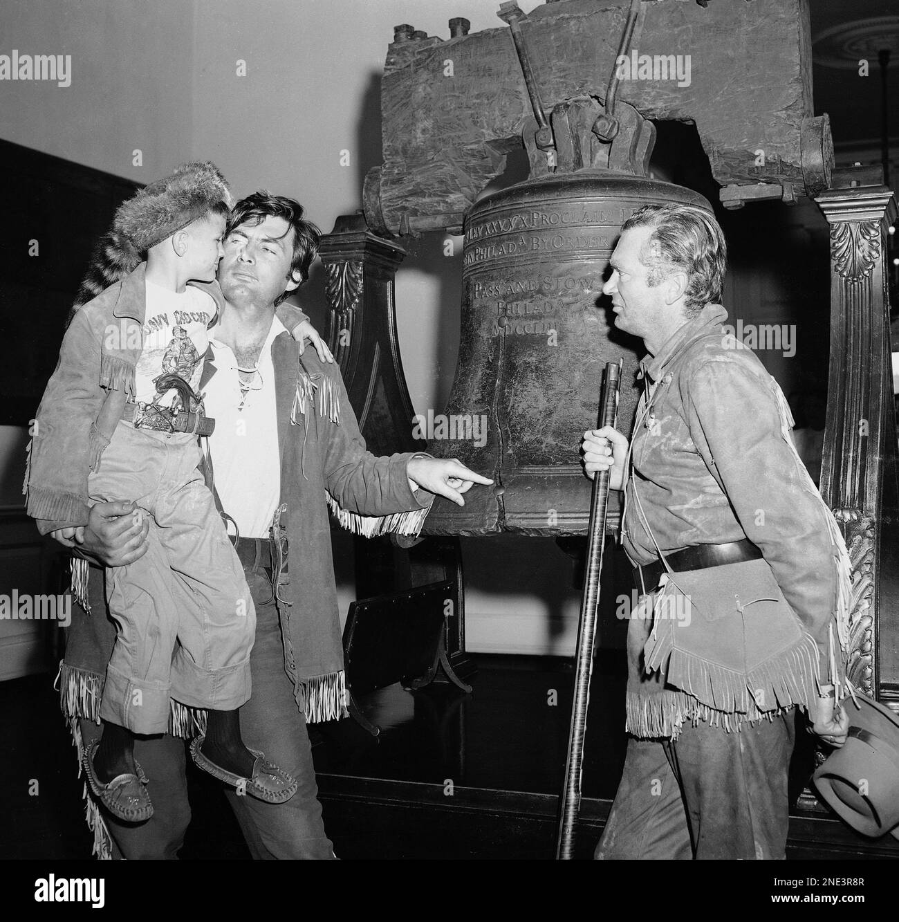 Davy Crockett, in the person of actor Fess Parker, points to the crack ...