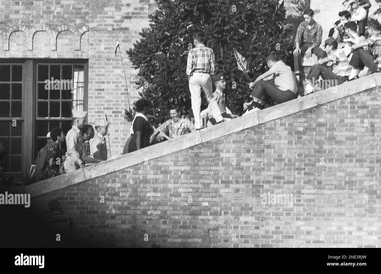 Five of nine black students as they walk up the long flight of stairs ...