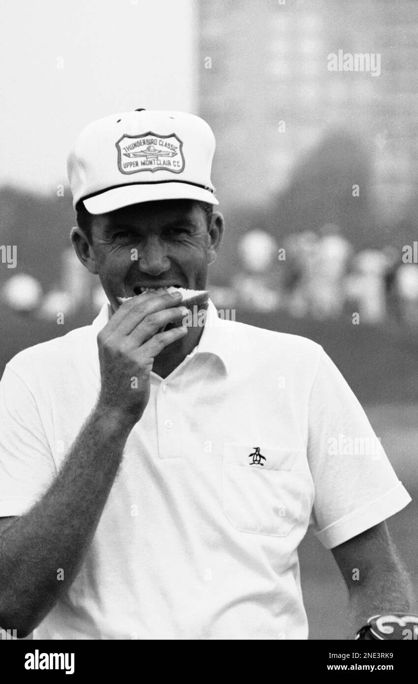 Golfer Al Geiberger, winner of the PGA Tournament, partakes of a peanut ...