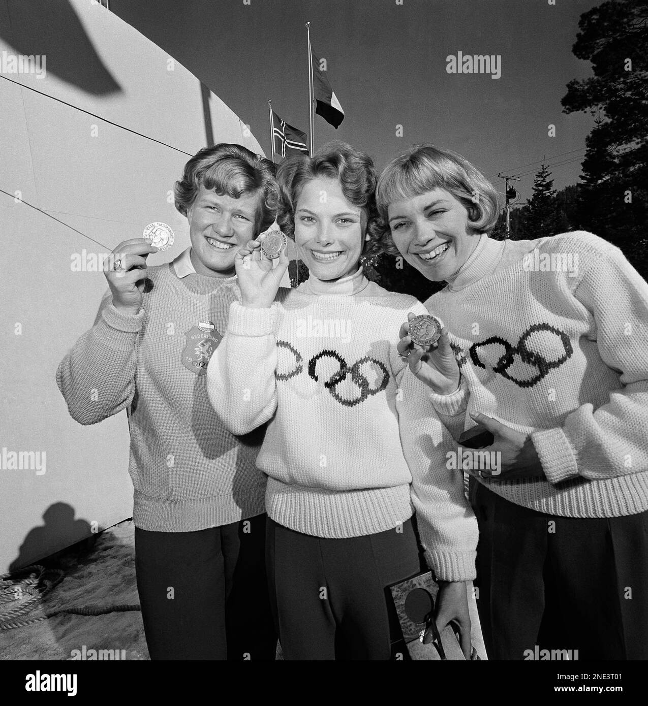 Carol Heiss of United States is flanked behave runners-up in the ...