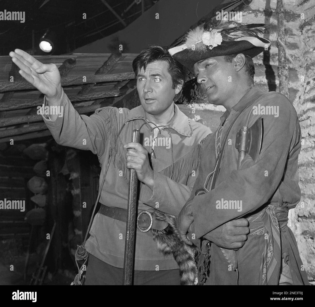 Fess Parker, star of NBC's "Daniel Boone" show, point out a feature of ...