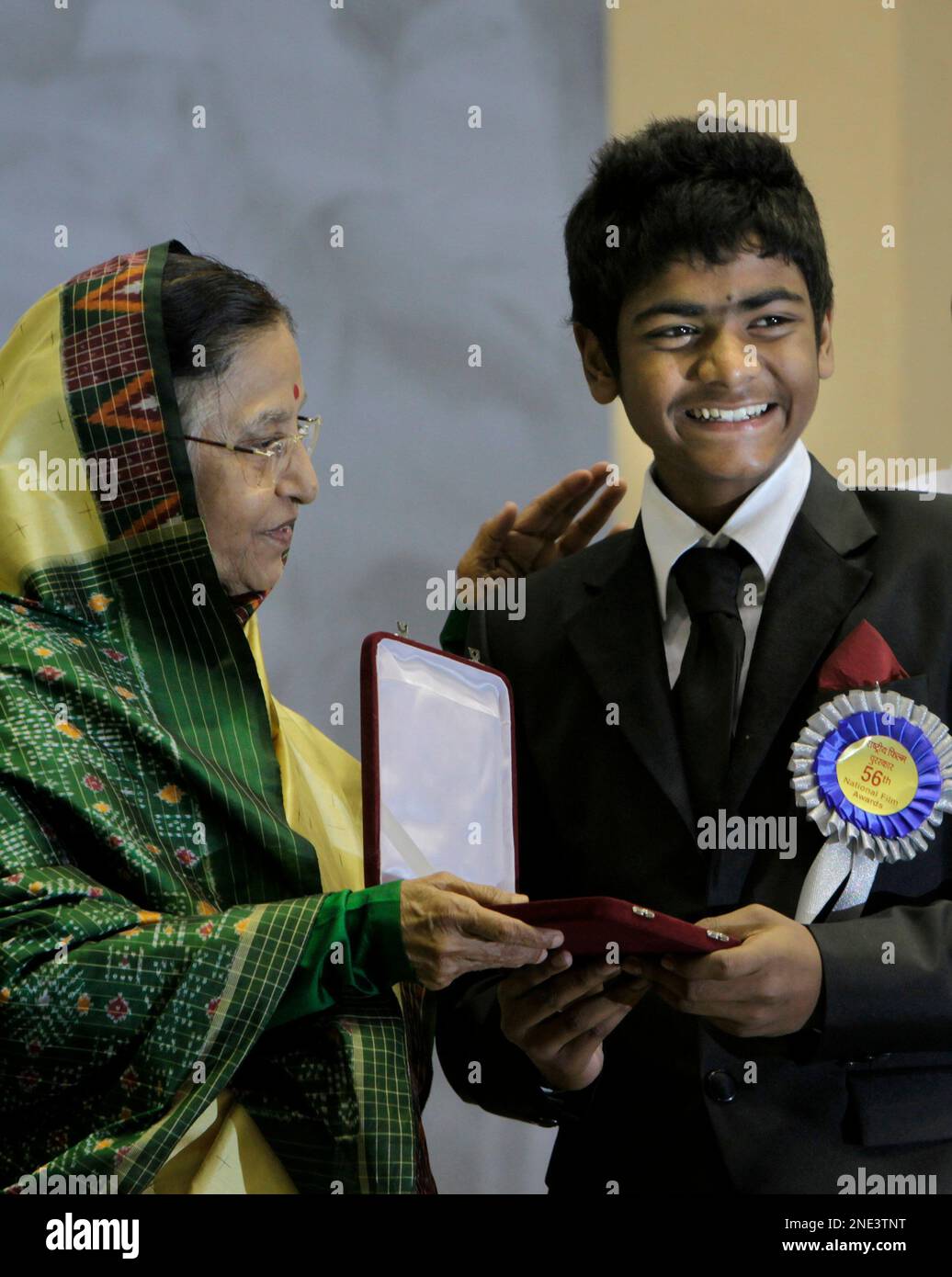 Indian President Pratibha Patil, left, presents the best child actor ...