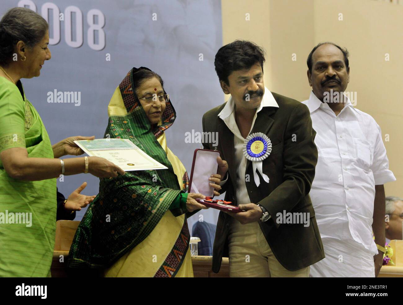 Indian President Pratibha Patil, second left, presents the best actor ...