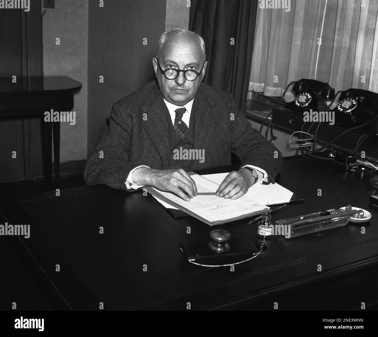 Sitting looking at camera spectacles authority hi-res stock photography ...