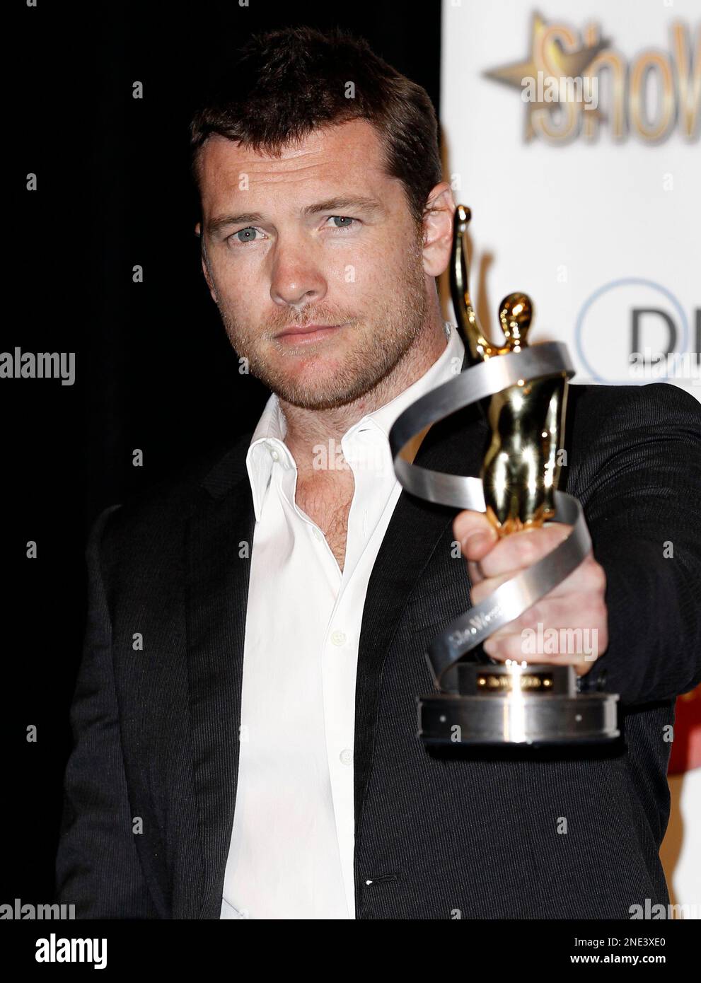 Actor Sam Worthington, winner of the Male Star of the Year Award, poses ...