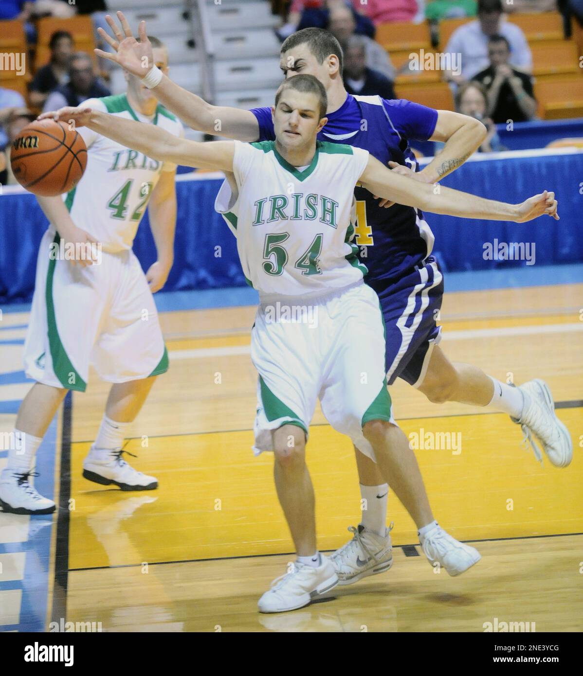 Charleston Catholic's Logan Riley (54) attempts to grab a loose ball ...