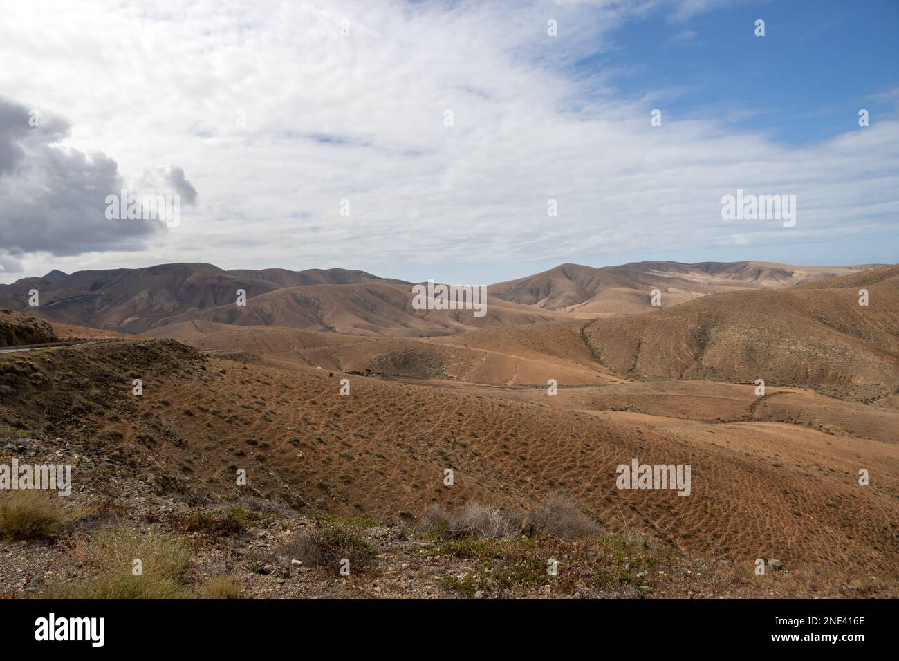 Shapes and lines of the mountains of the volcanic origin. Light brown ...