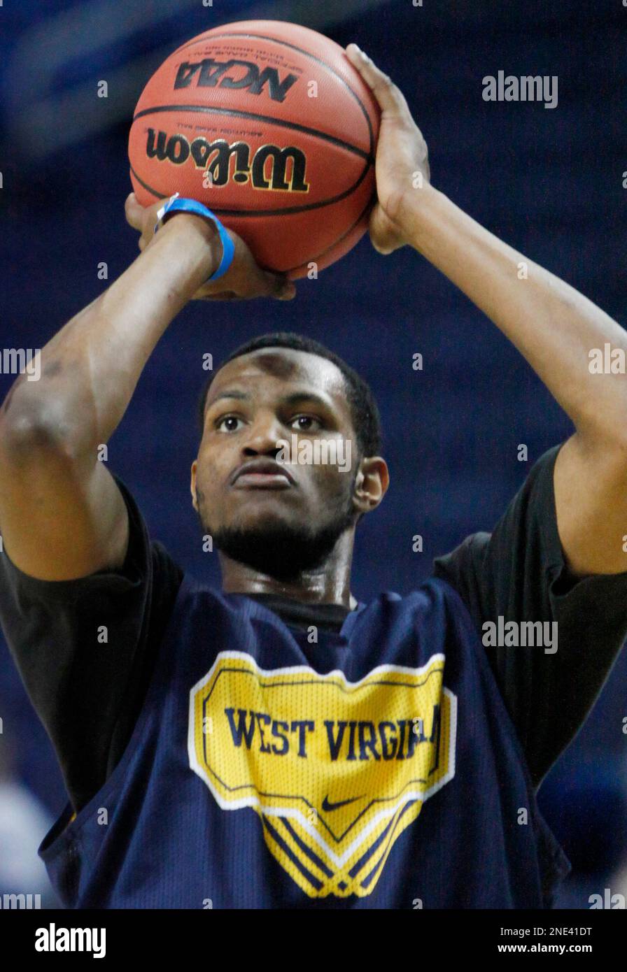 West Virginia's Devin Ebanks shoots during NCAA college basketball ...