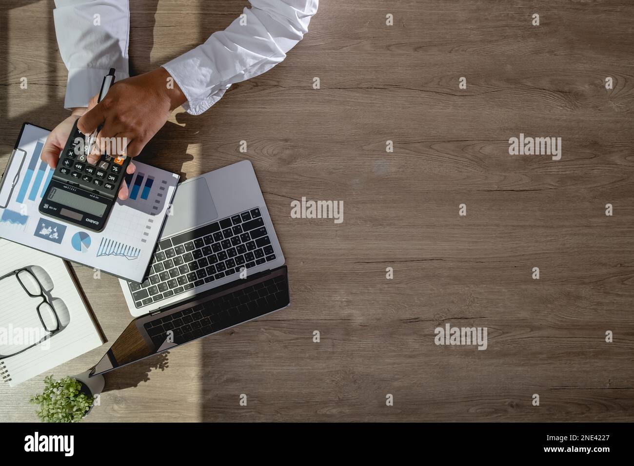 businessman using a calculator top view, calculating user expenses ...
