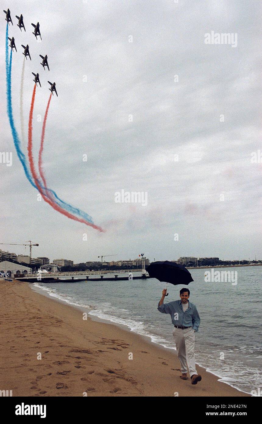 American actor Jon Cryer walks on the beach in the rain in Cannes ...