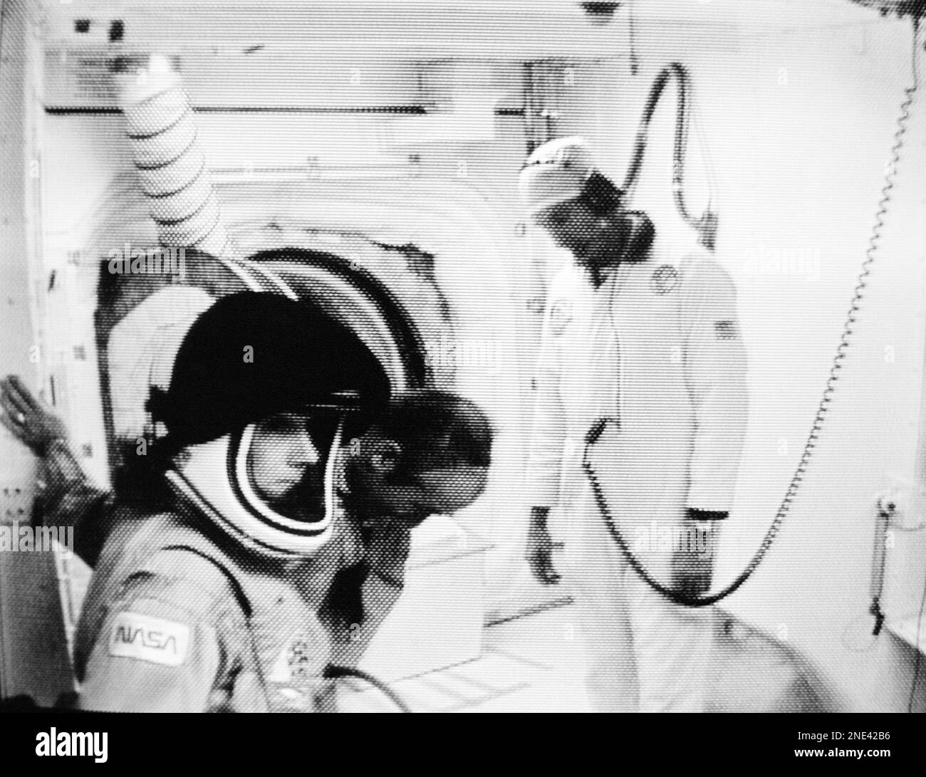 Space teacher Christa McAuliffe in her helmet, in the white room as she ...