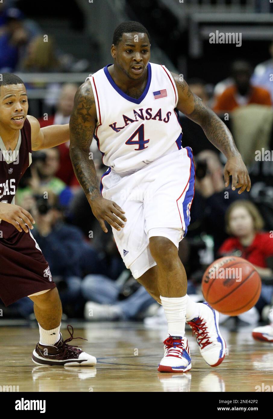 Kansas guard Sherron Collins, right, and Texas A&M guard B.J. Holmes ...