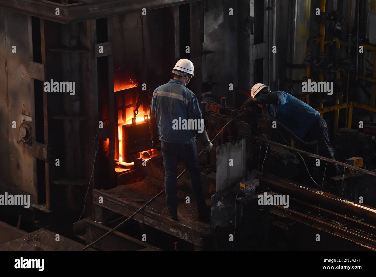SUQIAN, CHINA - FEBRUARY 16, 2023 - Workers make L-shaped steel at a ...