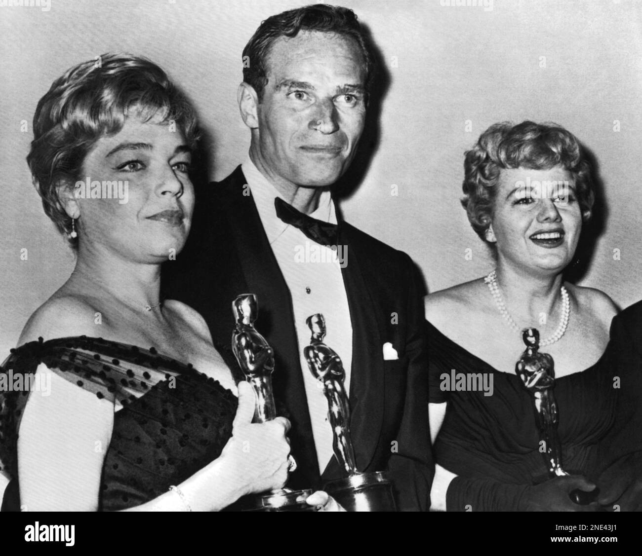American actor Charlton Heston, centre, with French actress Simone ...