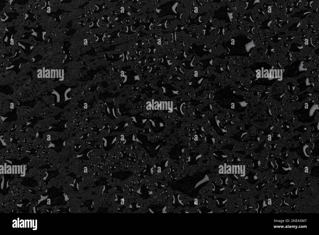 Water drops on dark stone surface texture background Stock Photo - Alamy