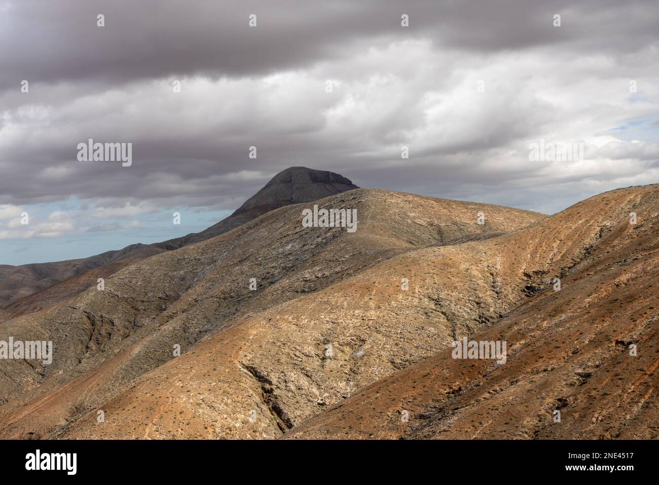 Shapes and lines of the mountains of the volcanic origin. Light brown ...