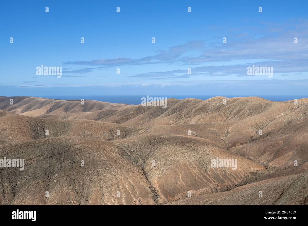 Shapes and lines of the mountains of the volcanic origin. Light brown ...