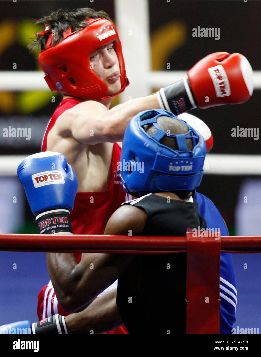 Wales' boxer Fred Evans, left, fights against Moabi Mothiba of Botswana ...