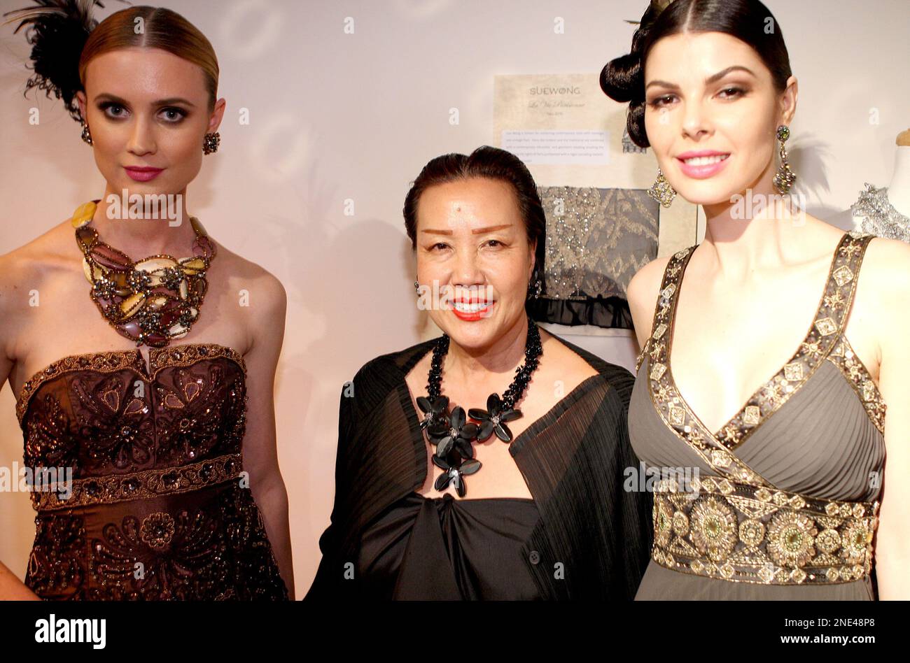 Designer Sue Wong (C) and models attend the Sue Wong Fall 2010 Preview ...