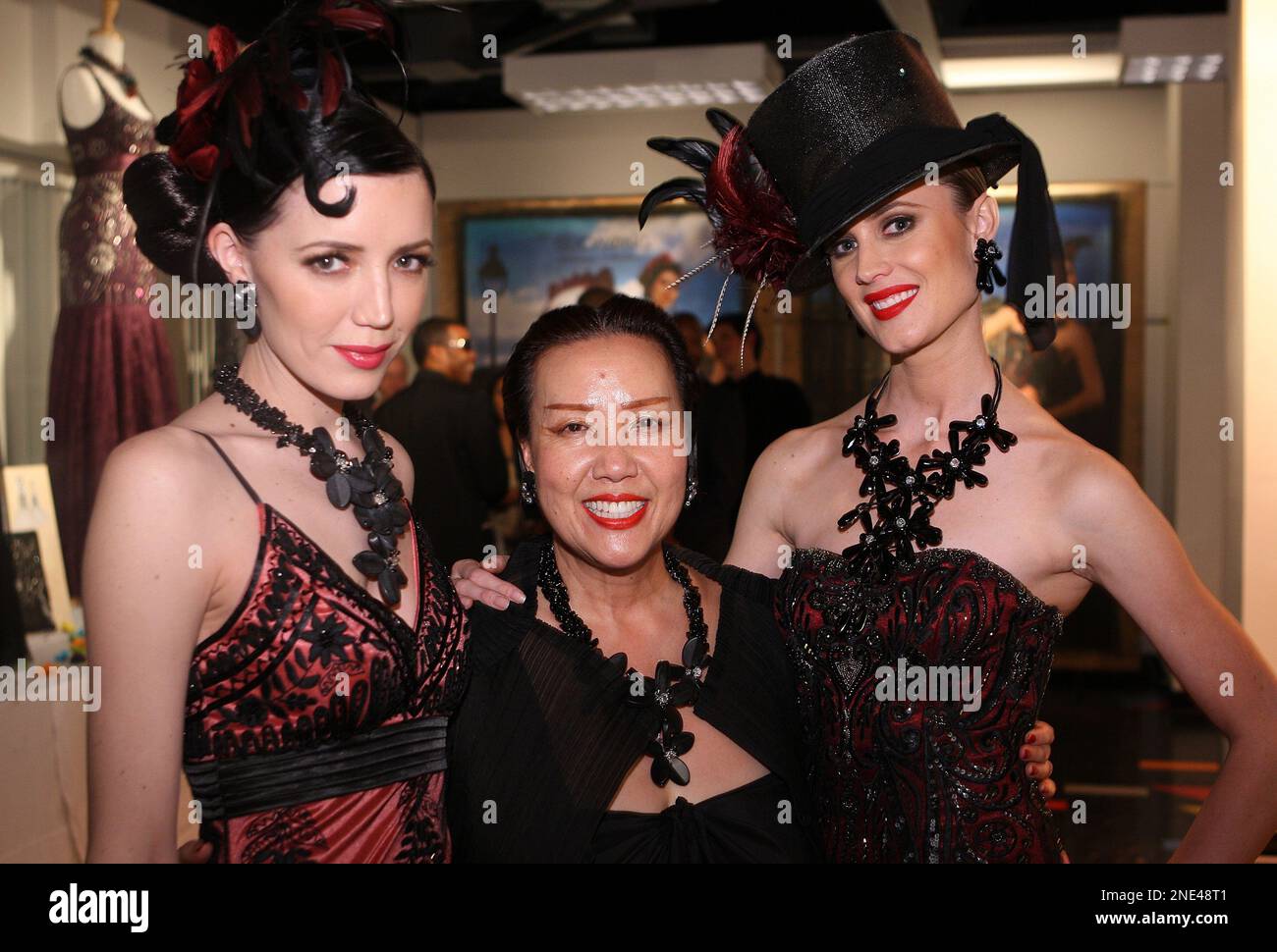 Designer Sue Wong (C) and models attend the Sue Wong Fall 2010 Preview ...