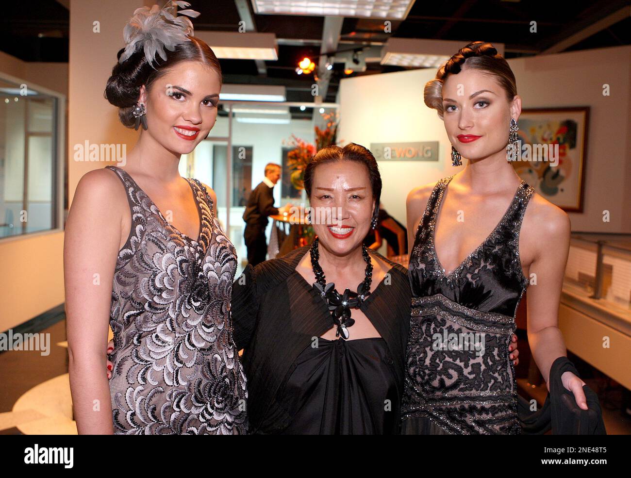 Designer Sue Wong (C) and models attend the Sue Wong Fall 2010 Preview ...