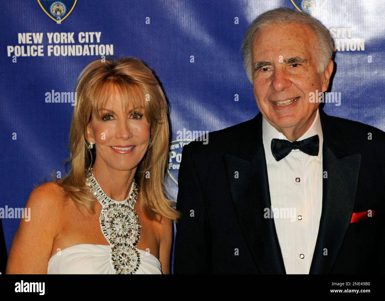 Financier Carl Icahn, right, and his wife, Gail, pose for photos upon ...