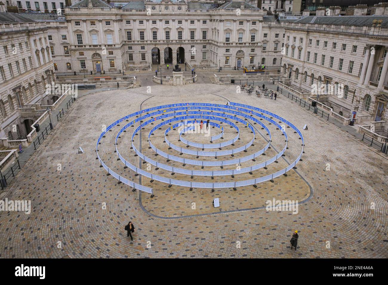London, UK. 16th Feb, 2023. Staff pose with the installation. Somerset House unveils a 30-metre ...