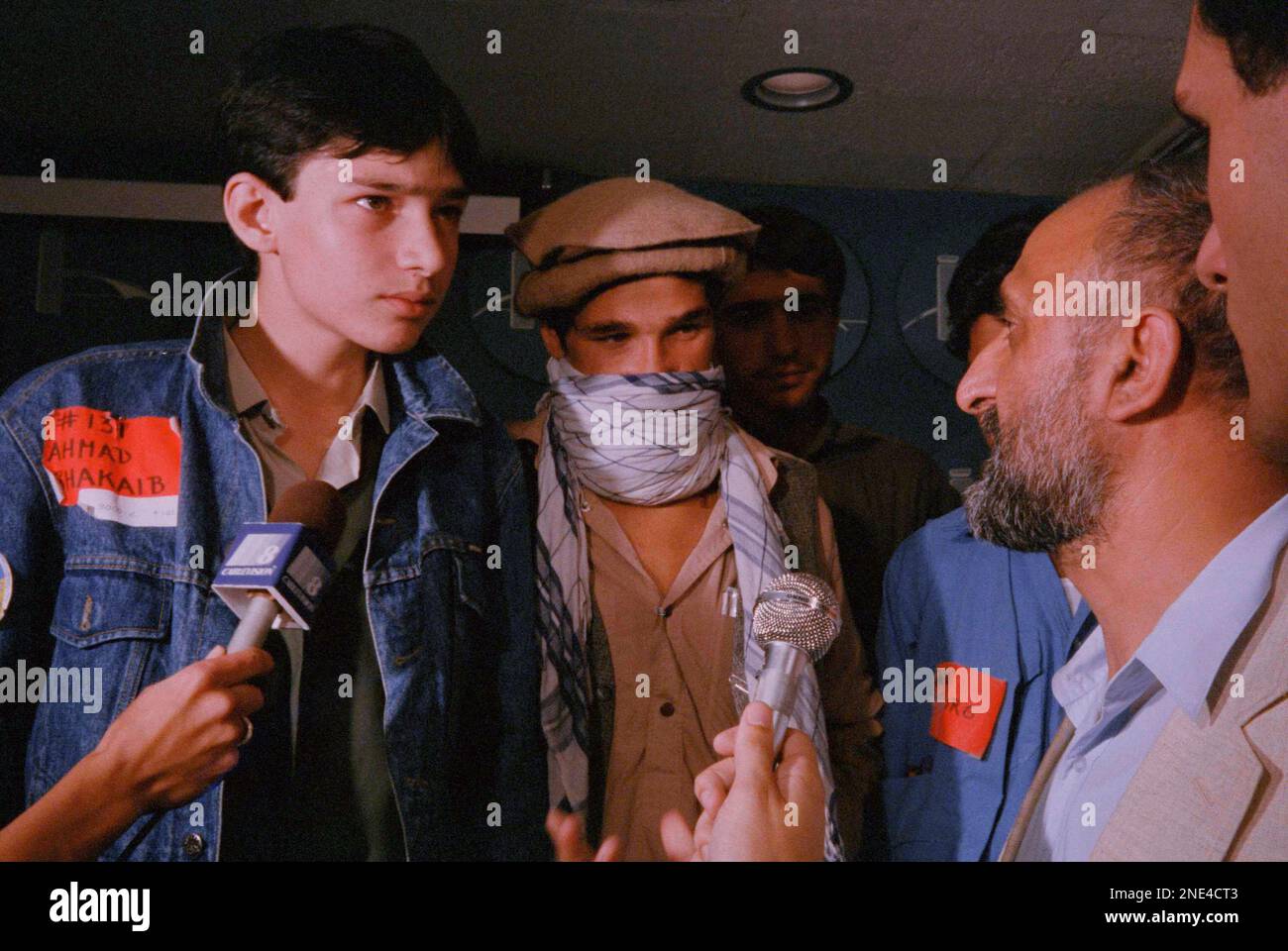 Ahmad, left, Sherim, wearing scarf, Wali, in back row, Burzurg, hidden ...