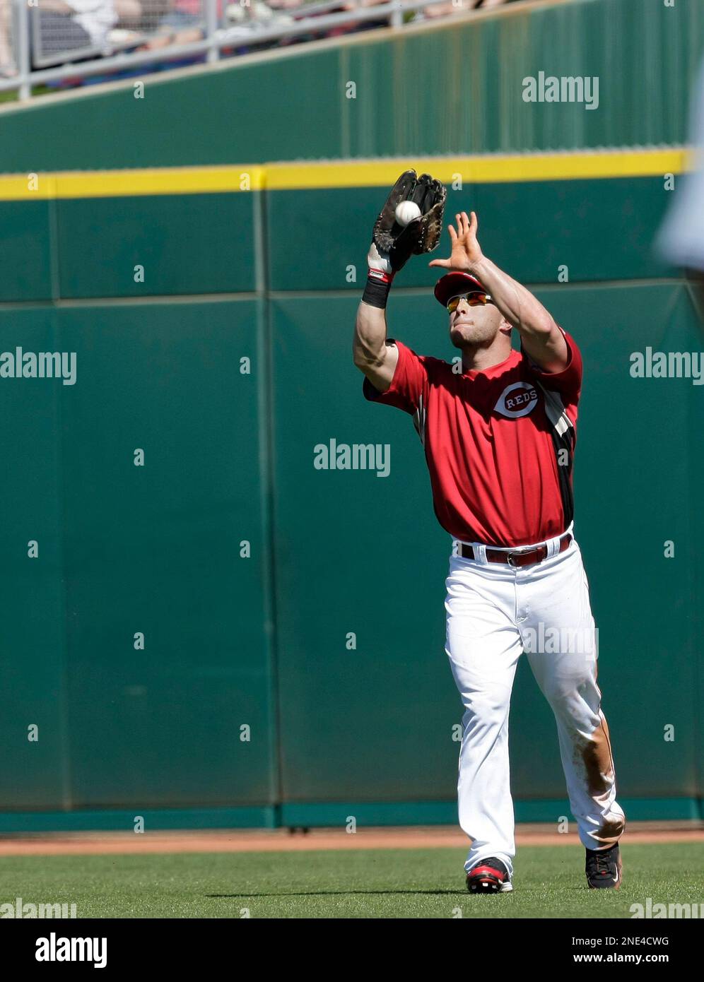Cincinnati Reds left fielder Laynce Nix catches a fly ball in a spring ...