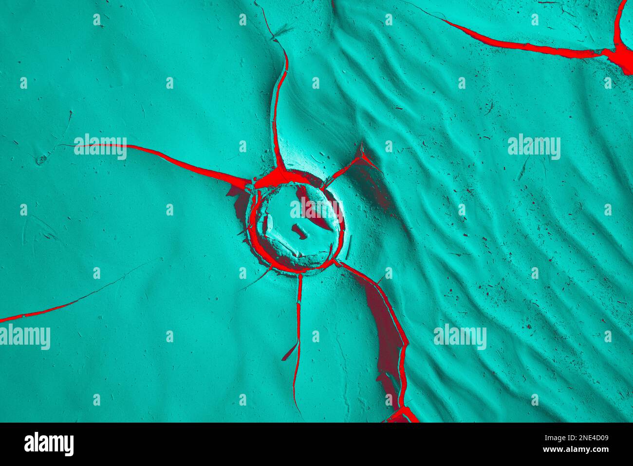 Vibrant bold abstract colourful patterns of dried mud in a dry river ...