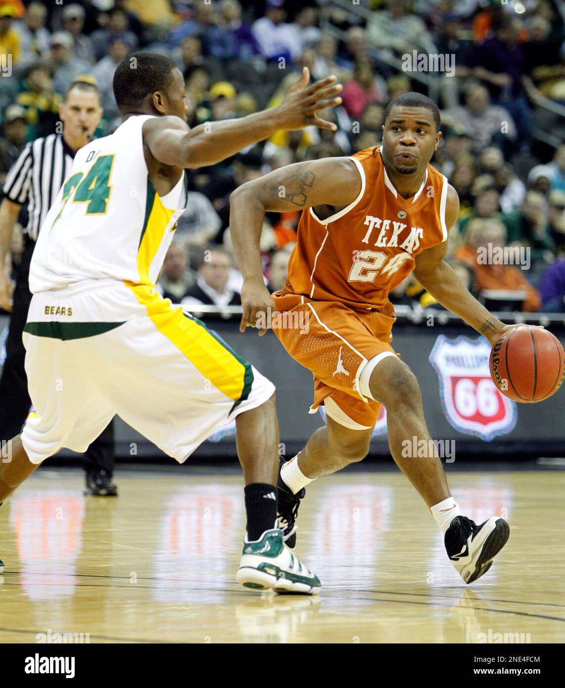 Texas guard Justin Mason, right, drives around Baylor guard LaceDarius ...
