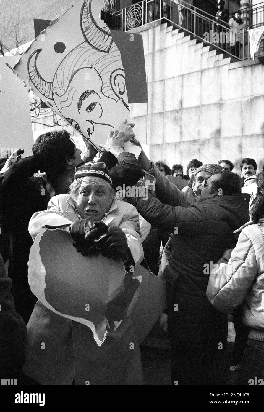 Afghani demonstrators rip apart a poster of Soviet leader Leonid ...