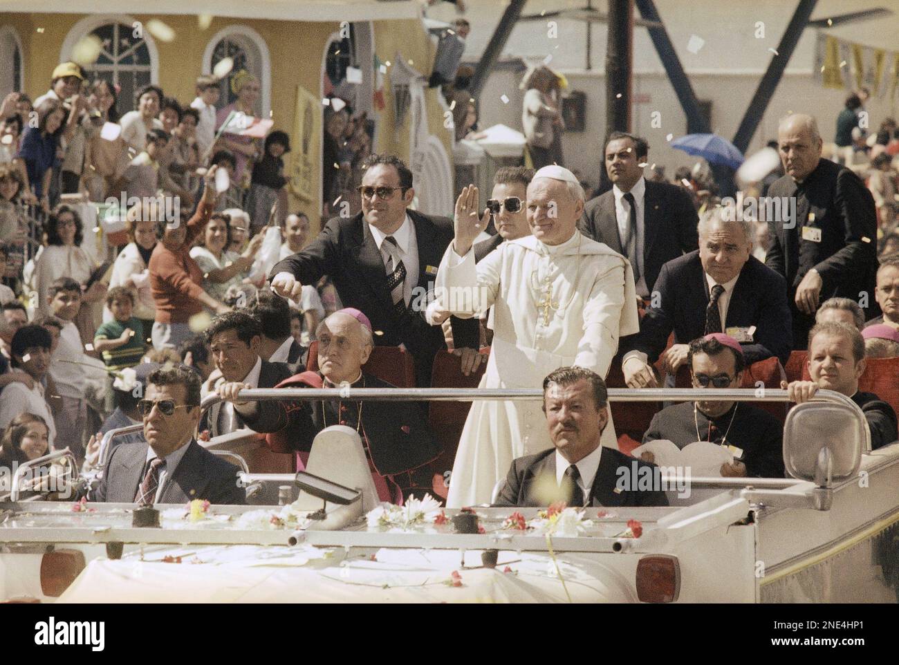 Pope John Paul II cheered by thousands of people as his motorcade moved ...