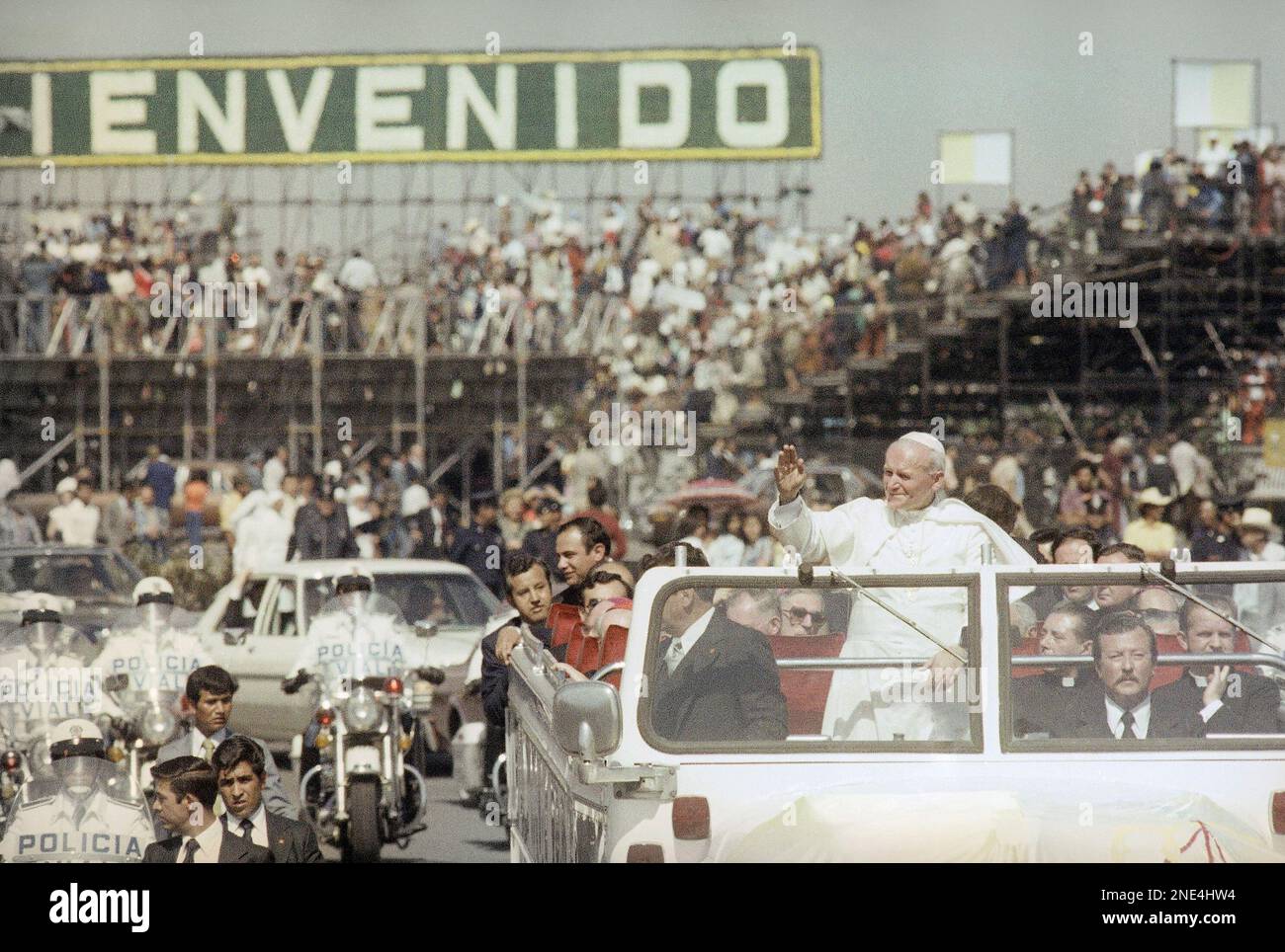 Pope John Paul II blesses the crowd at the start of his motorcade thru ...