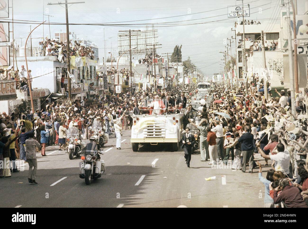 Pope John Paul II cheered by thousands of people as his motorcade moved ...