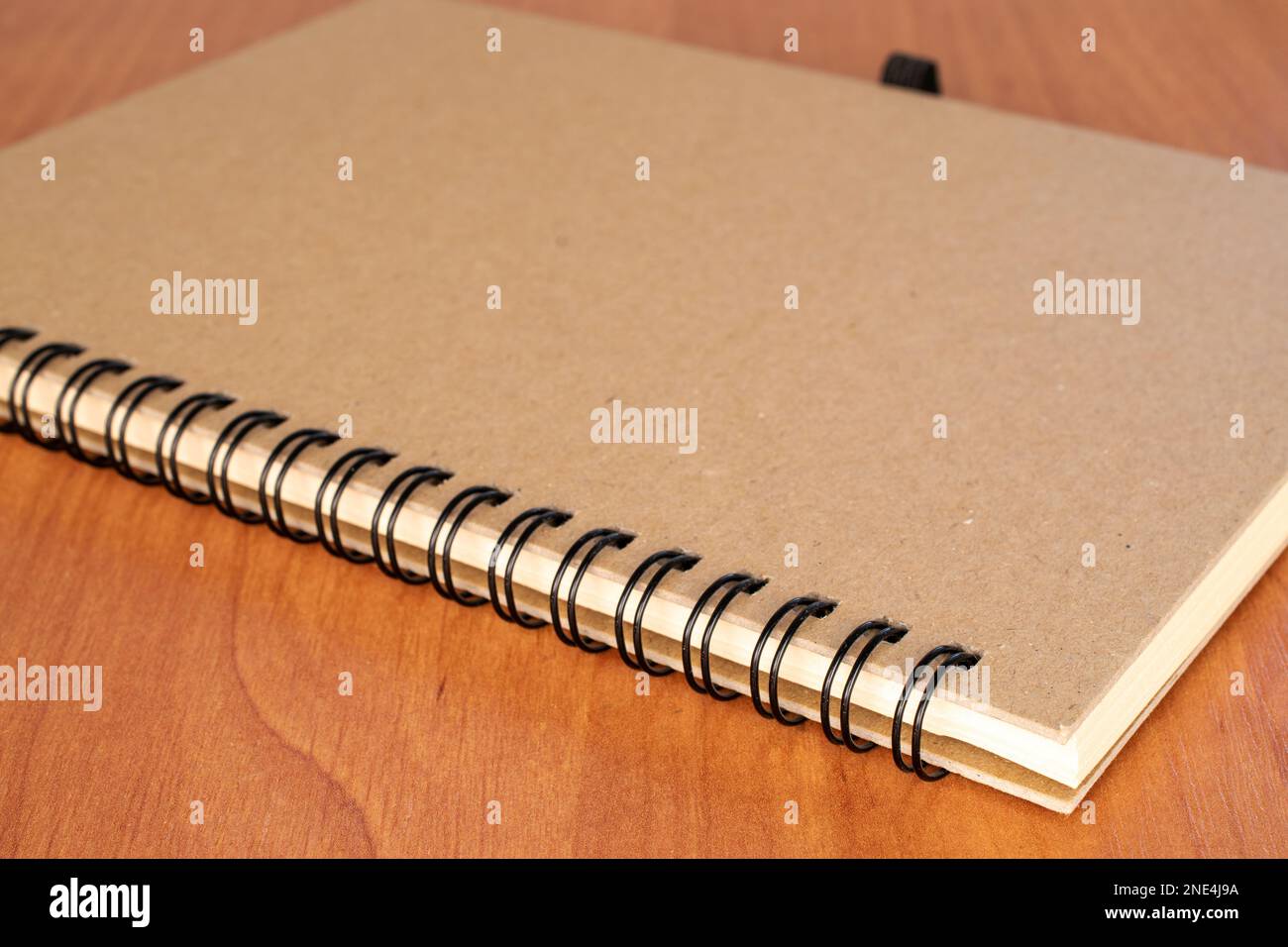 One notebook on an office desk, close-up Stock Photo - Alamy