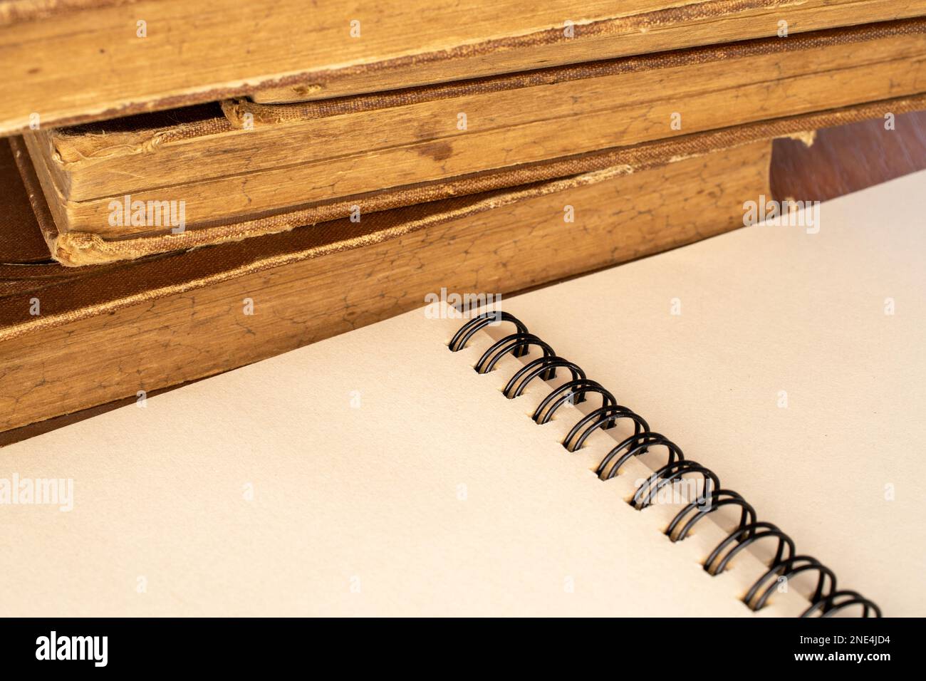 One notebook and several books on an office desk, close-up Stock Photo ...