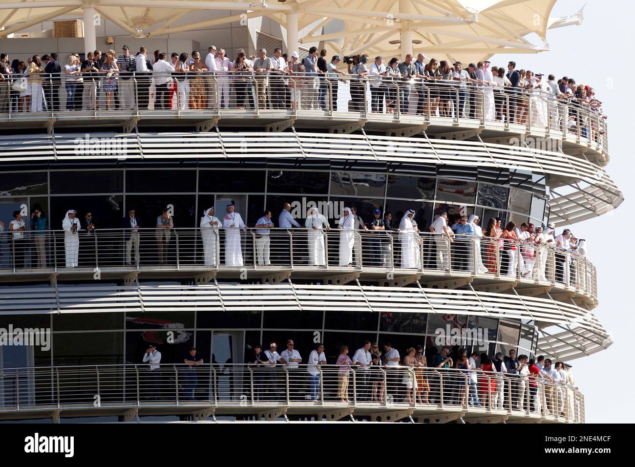 Spectators stand on the balconies of the VIP tower before the start of ...