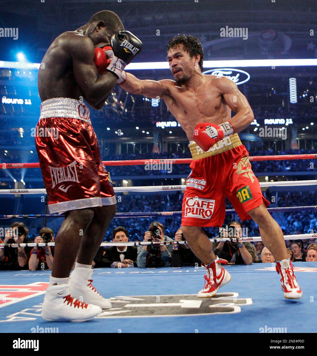 Manny Pacquiao, right, of the Philippines, reaches out to hit Joshua ...