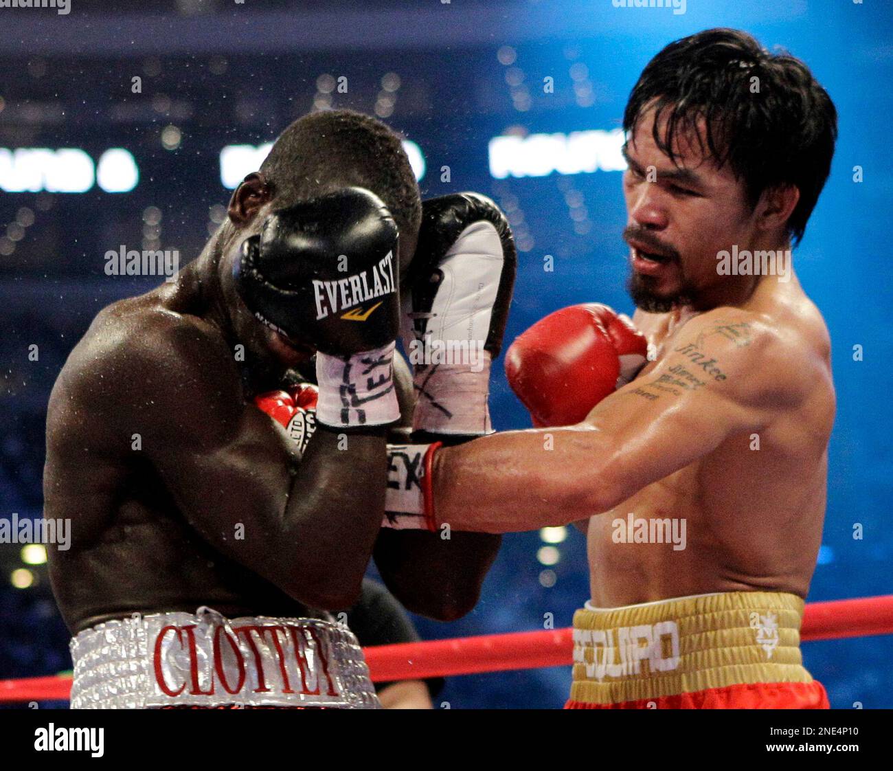 Manny Pacquiao, right, of the Philippines, hits Joshua Clottey, from ...