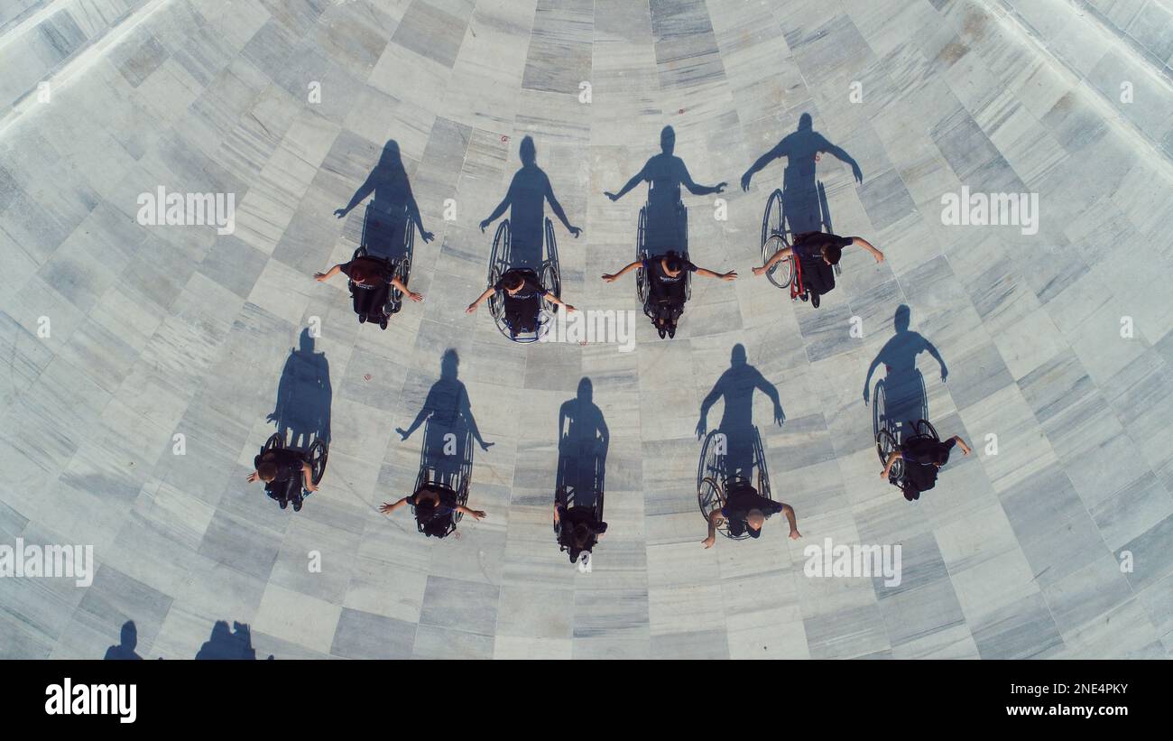 aerial view of shadows of disabled people dancing on wheelchair photo ...