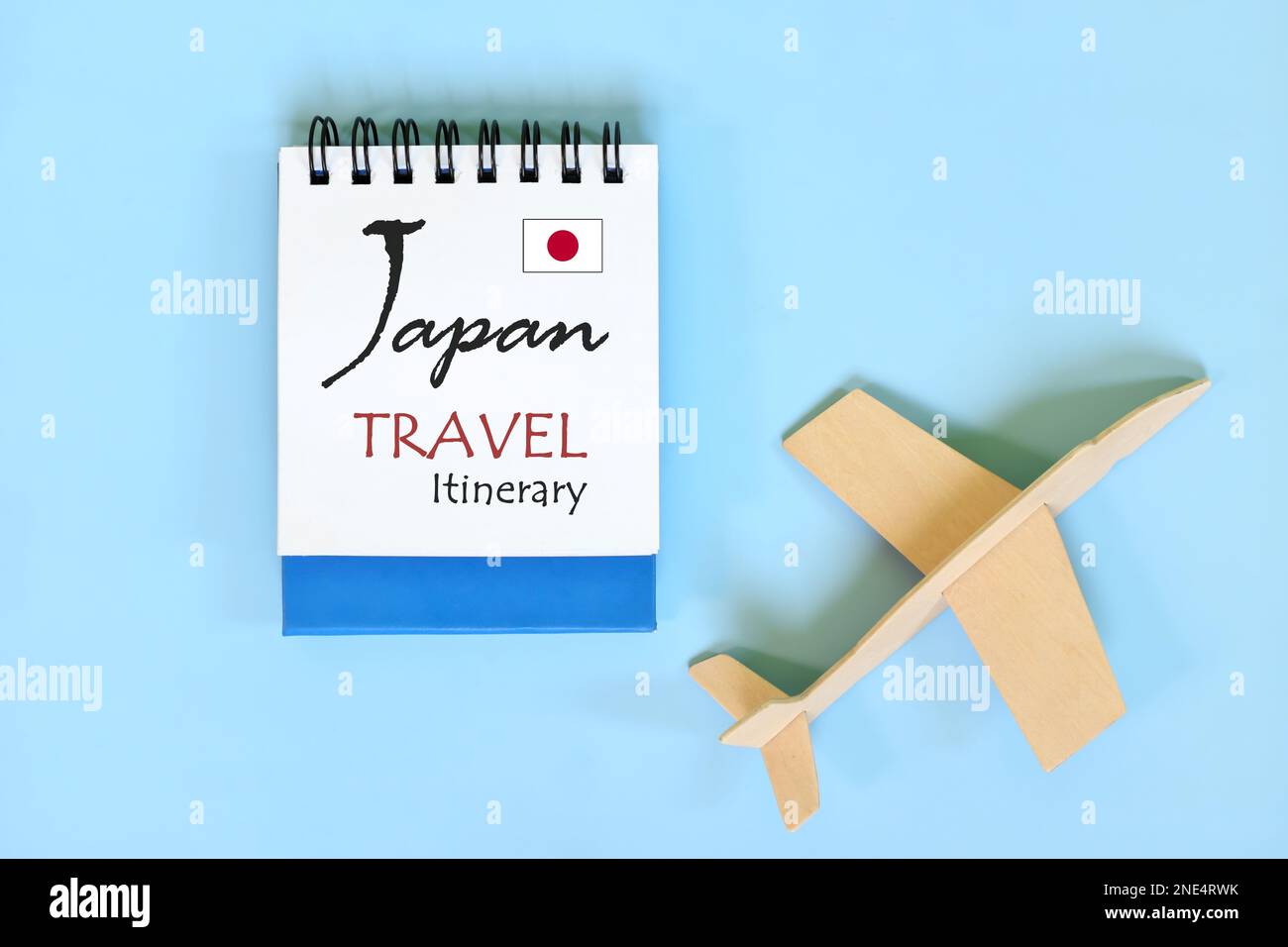 Japan travel plan or itinerary written on blue notepad with flag and ...