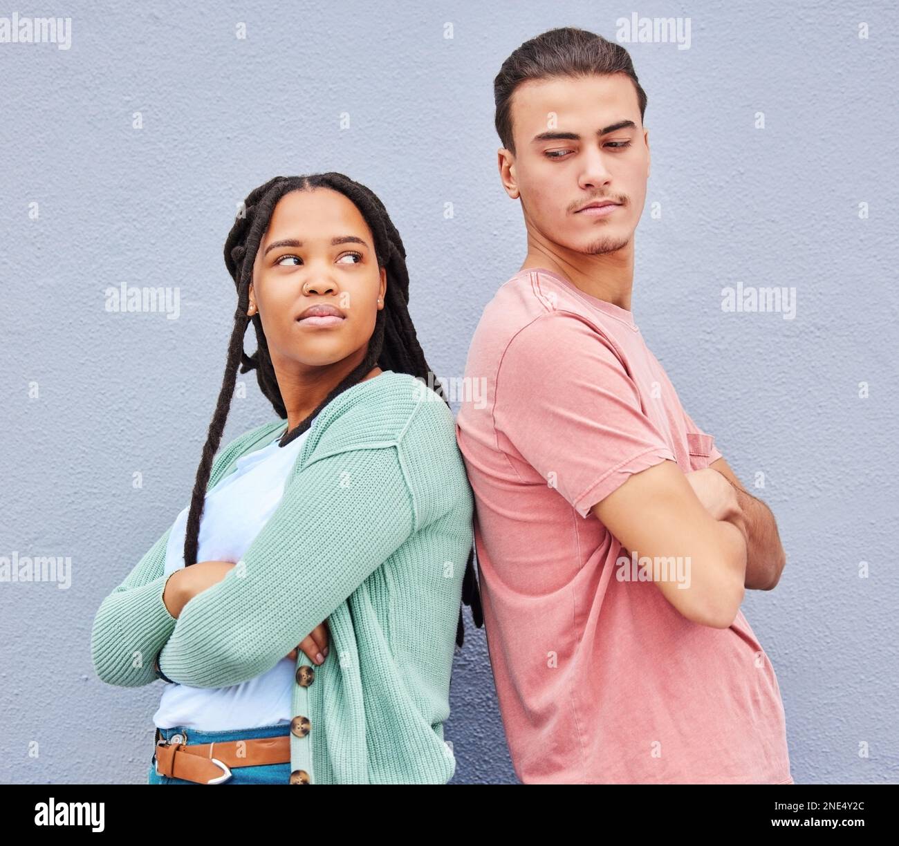 Disagreement, mad and angry with interracial couple and wall background ...