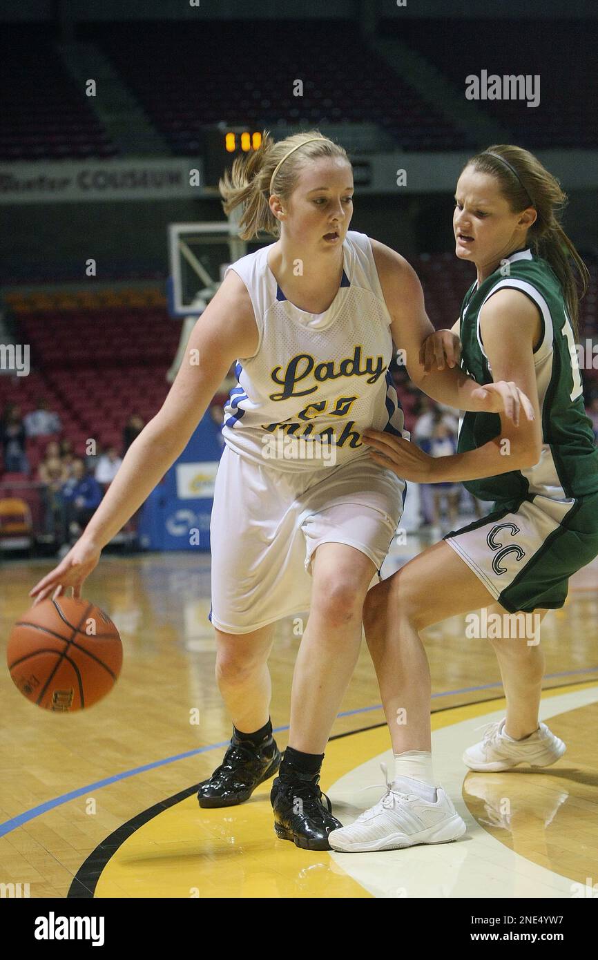 St. Joseph's Sara Sang drives past Charleston Catholic's Ally Hoyer on ...