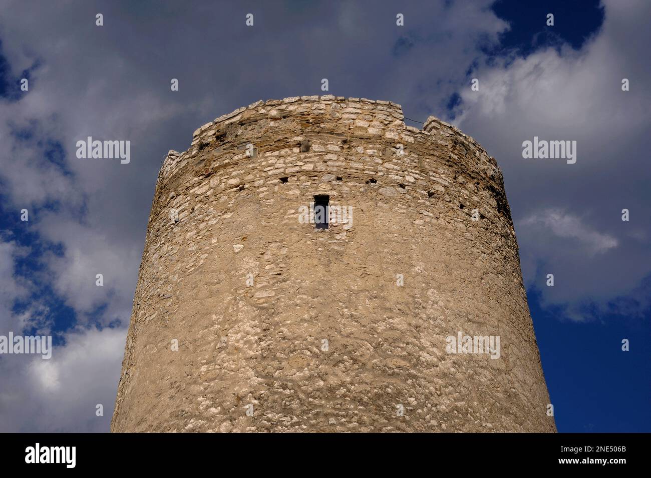 Battlemented summit of the massive medieval round castle keep or donjon ...