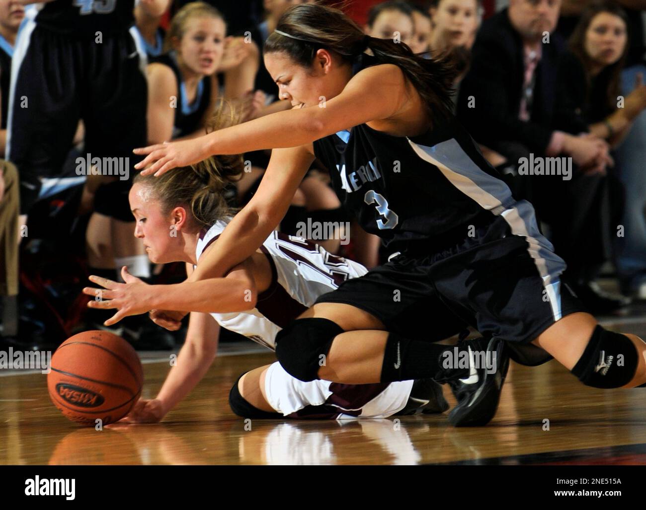 Henderson County's Krista Norman and Mercy's Malisa Cruz dive for a ...