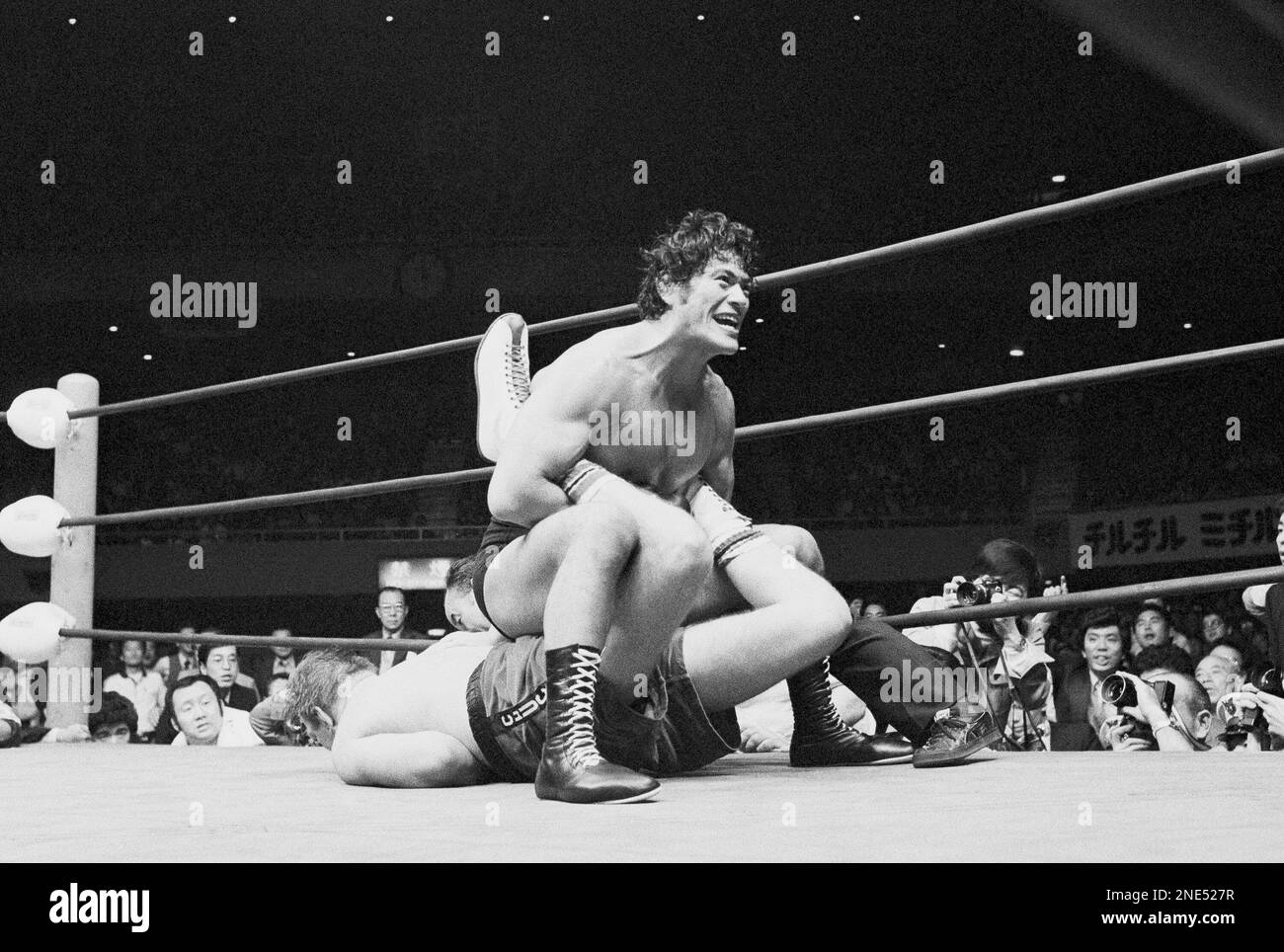 Japanese pro wrestler Antonio Inoki clamps leg hold on boxer Chuck ...
