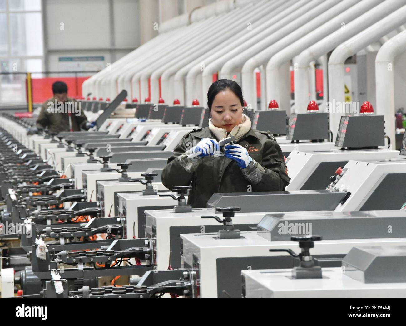 HANDAN, CHINA - FEBRUARY 16, 2023 - A worker measures products at a ...