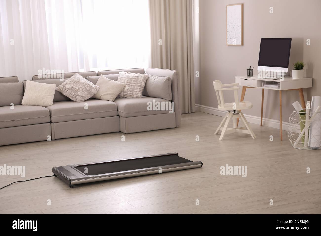 Modern walking treadmill in living room. Home gym equipment Stock Photo ...